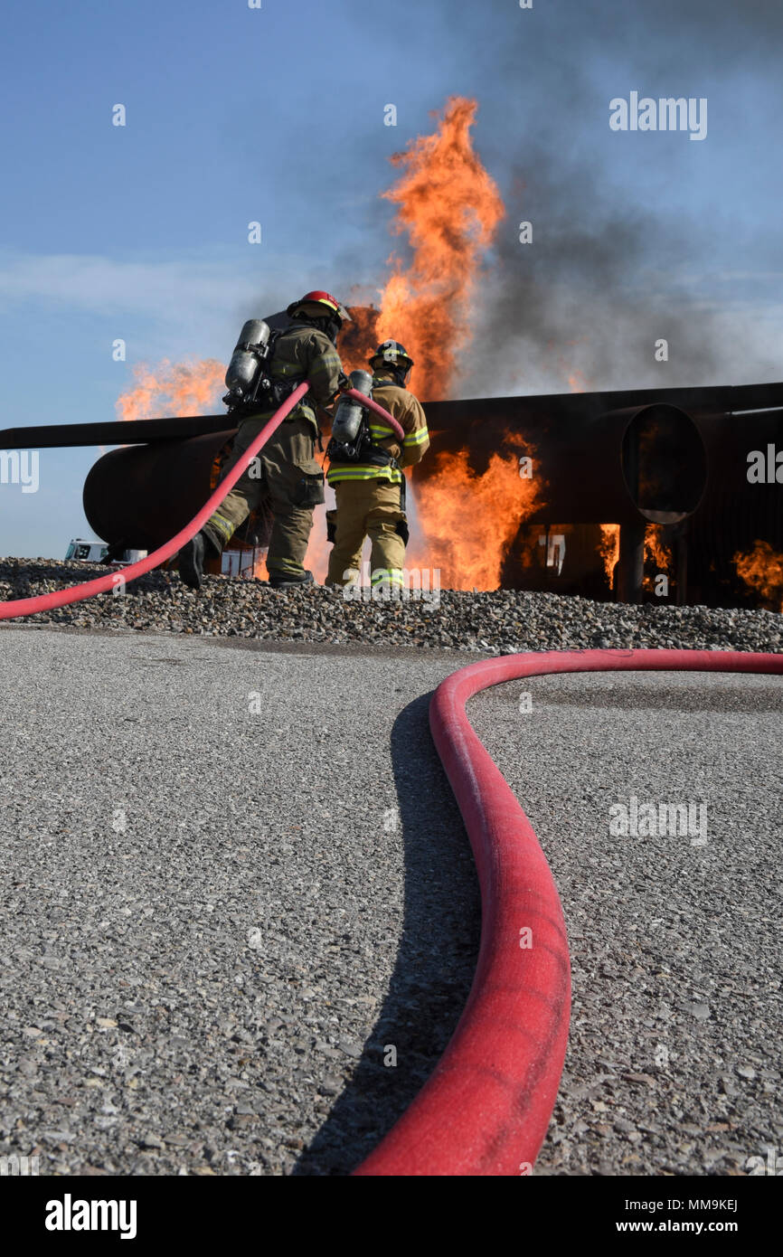 Members of the Tulsa Fire Department conduct training using a full-size ...