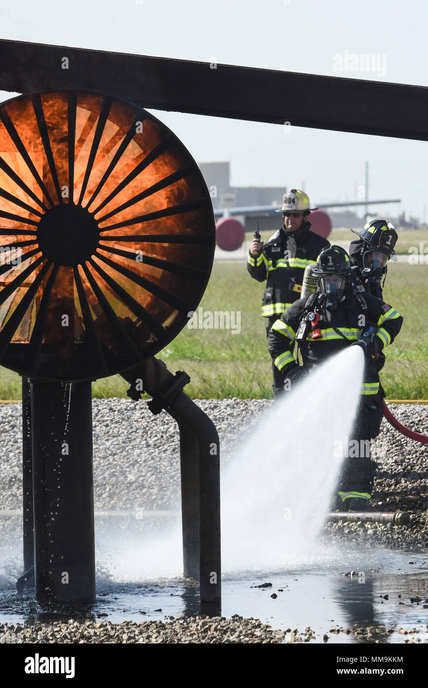 Members of the 72nd Civil Engineer Squadron, fire department, approach ...