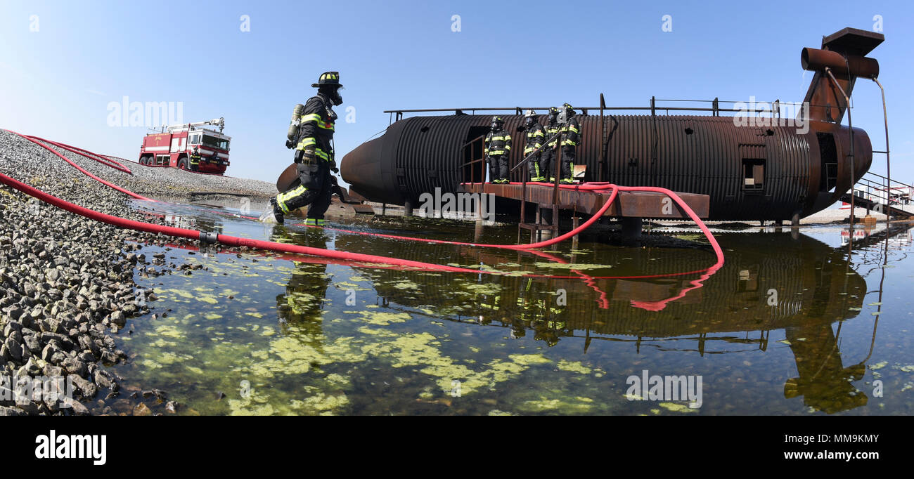 A member of the 72nd Civil Engineer Squadron, fire department, walks ...