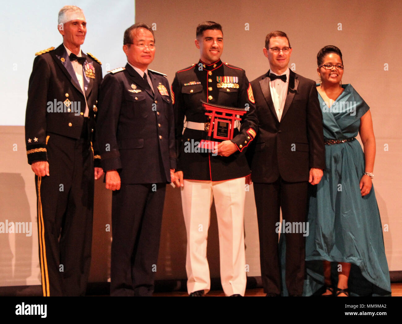 U.S. Marine Corps Staff Sgt. Jeffrey Burke, center, detention facility ...