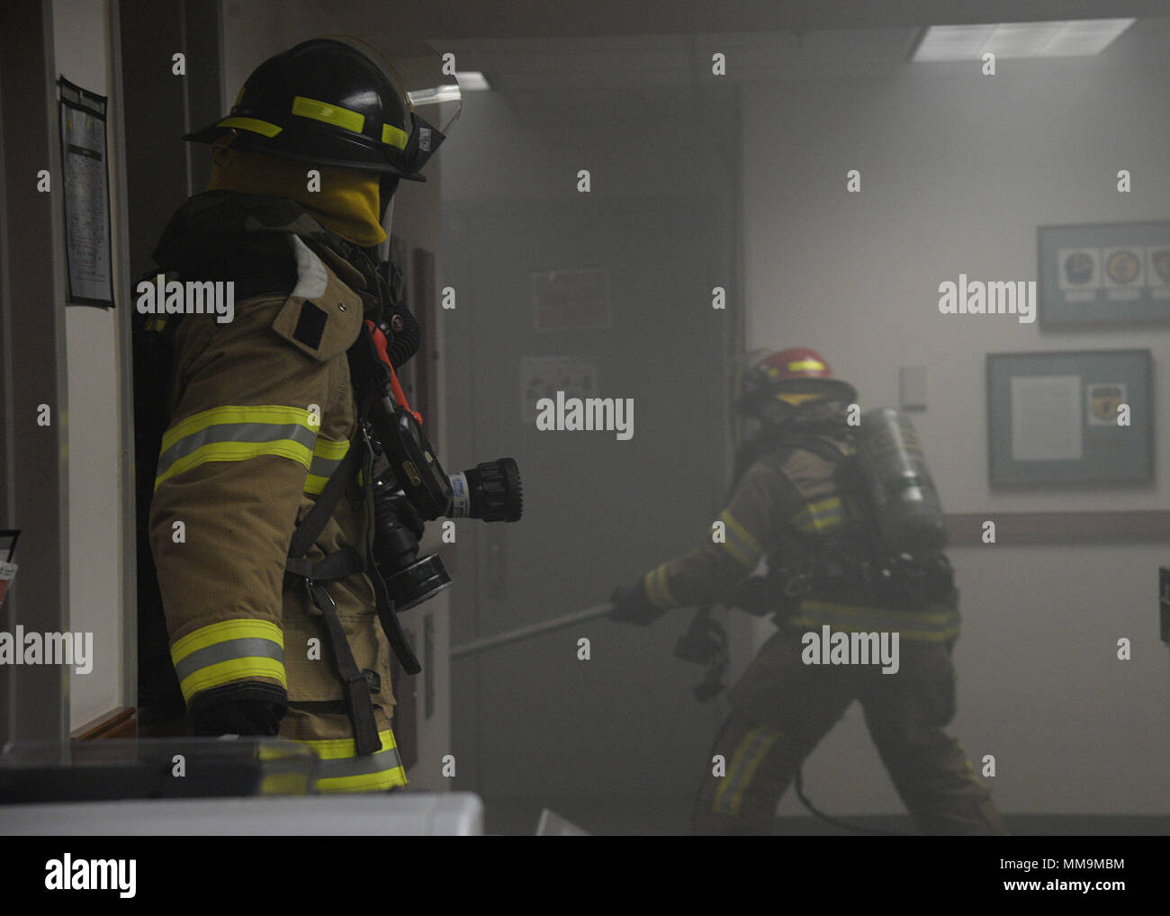 Senior Airman Kristopher Morgan, left, 51st Civil Engineer fire ...