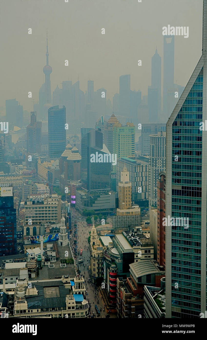 polluted air, Skyline. At left Oriental Pearl Tower. At righ Jin Mao ...