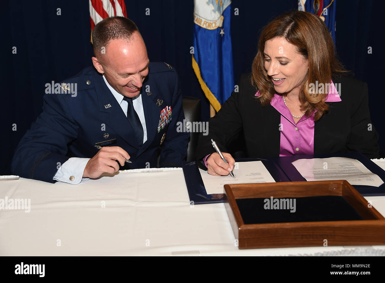 Col Charles Roberts, the 61st Air Base Group Commander, and Ms. Debra ...