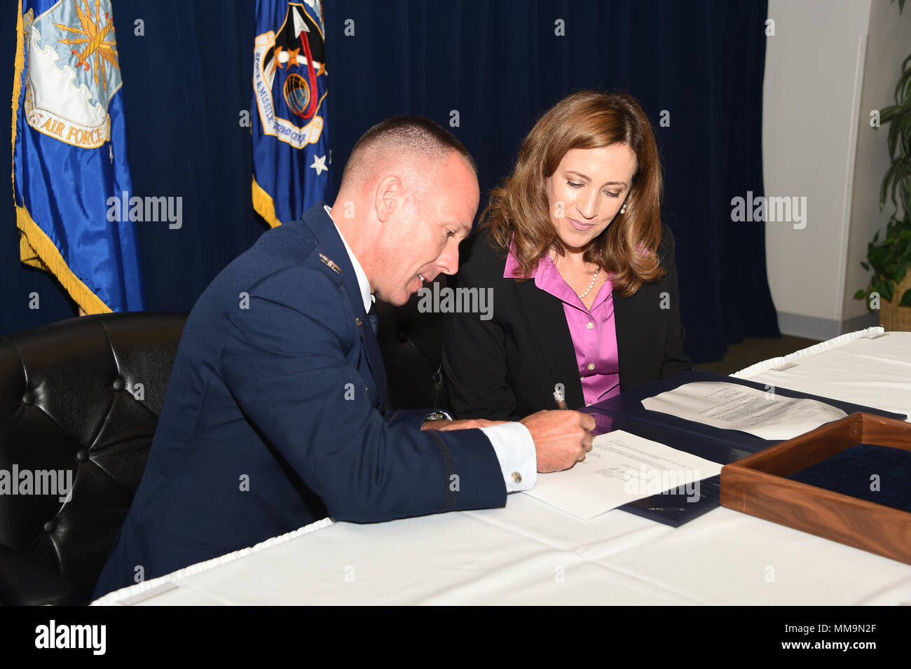 Col Charles Roberts, the 61st Air Base Group Commander, and Ms. Debra ...