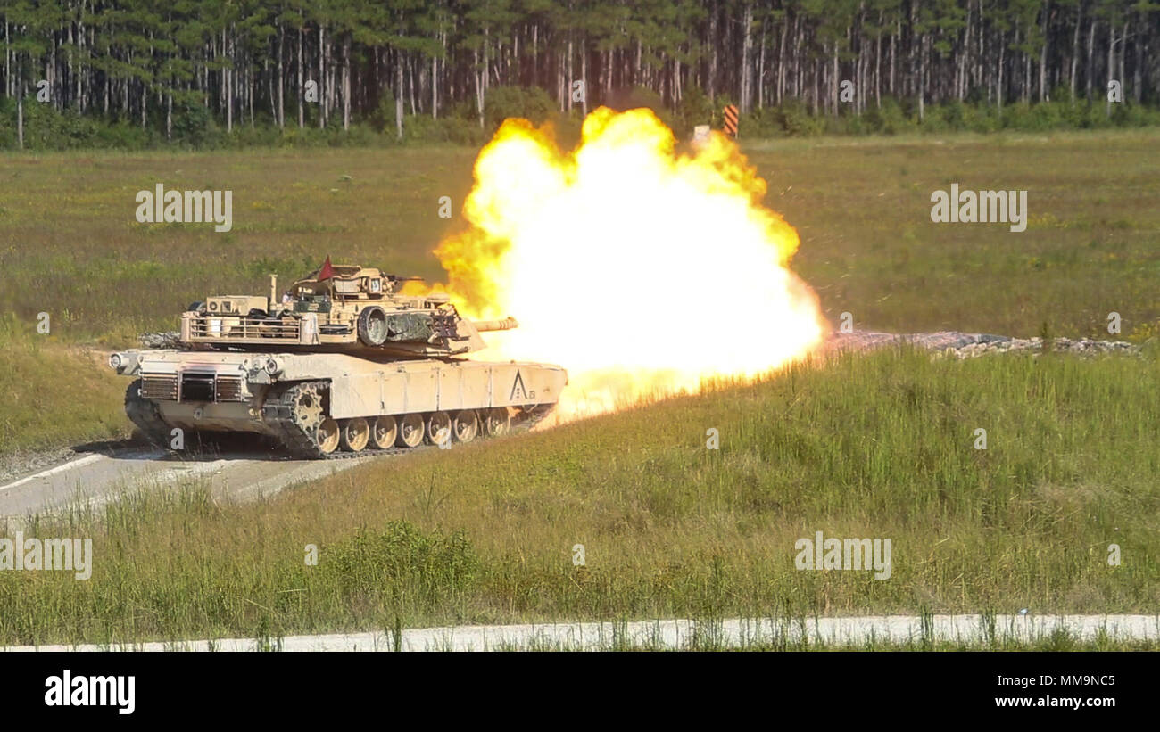 Marines fire an M1A1 Abrams tank during a gunnery range at Camp Lejeune ...