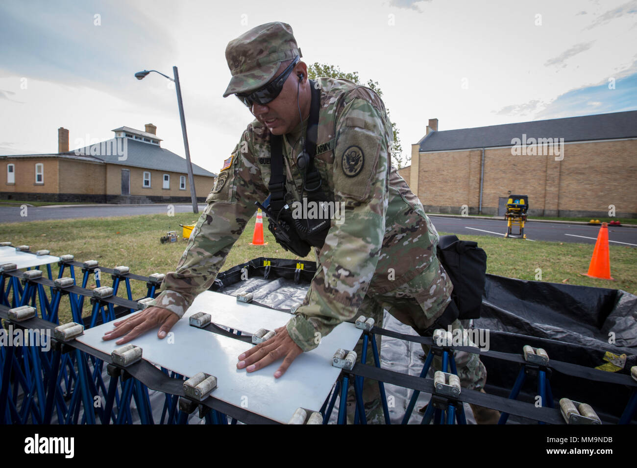 U.S. Army Sgt. 1st Class Maykell Guerrero assembles a decontamination ...