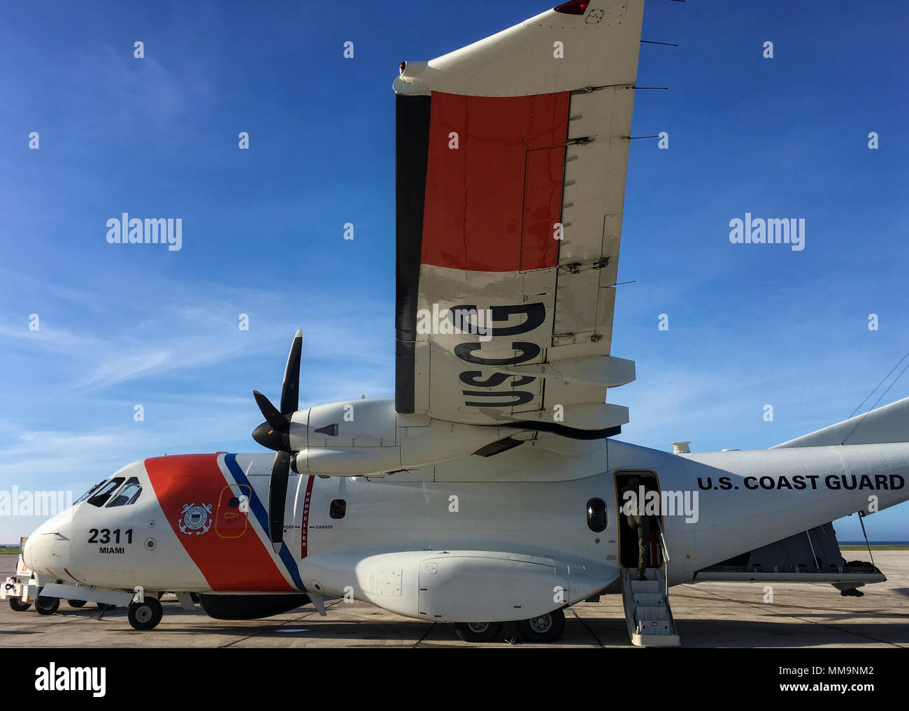 U.S. Coast Guard crewmembers from the Air Station Miami, Florida board ...