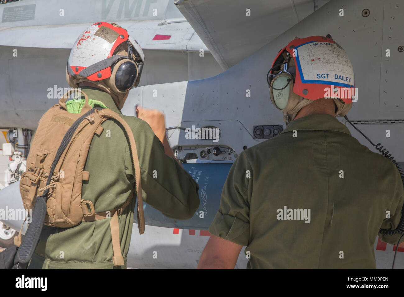 U.S. Marine Corps Sgt. Patrick Opp, left, an Aircraft Ordnance ...