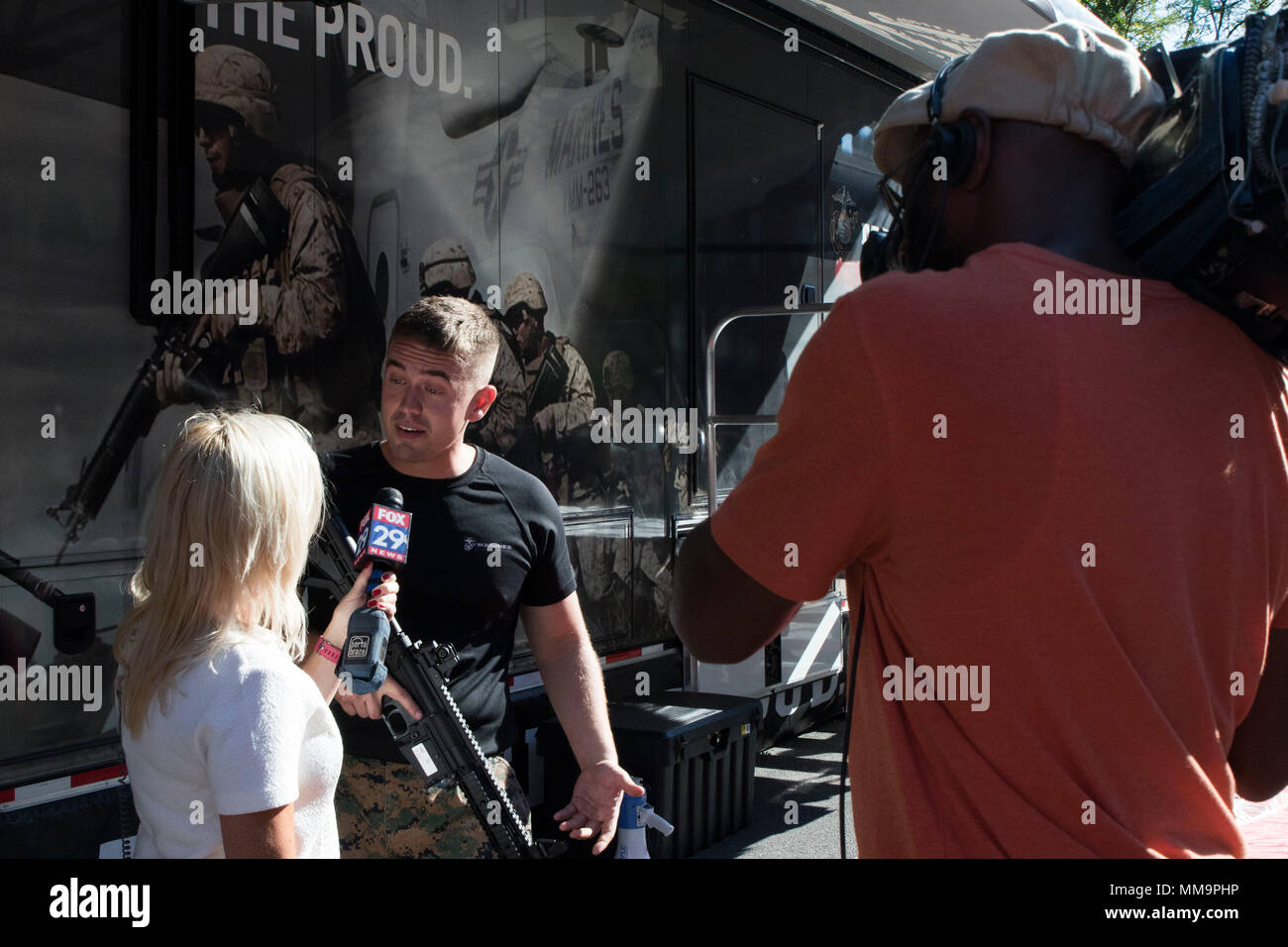 U.S. Marine Corps Sgt. Glenn Mills is interviewed by Jennaphr Fredrick ...