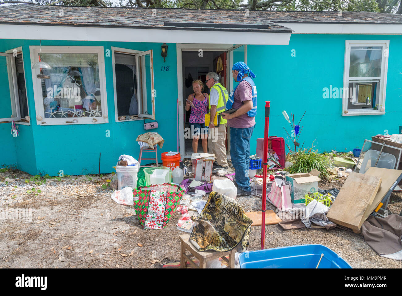 Disaster survivor assistants John Robello, right, and Guido Gallucci ...