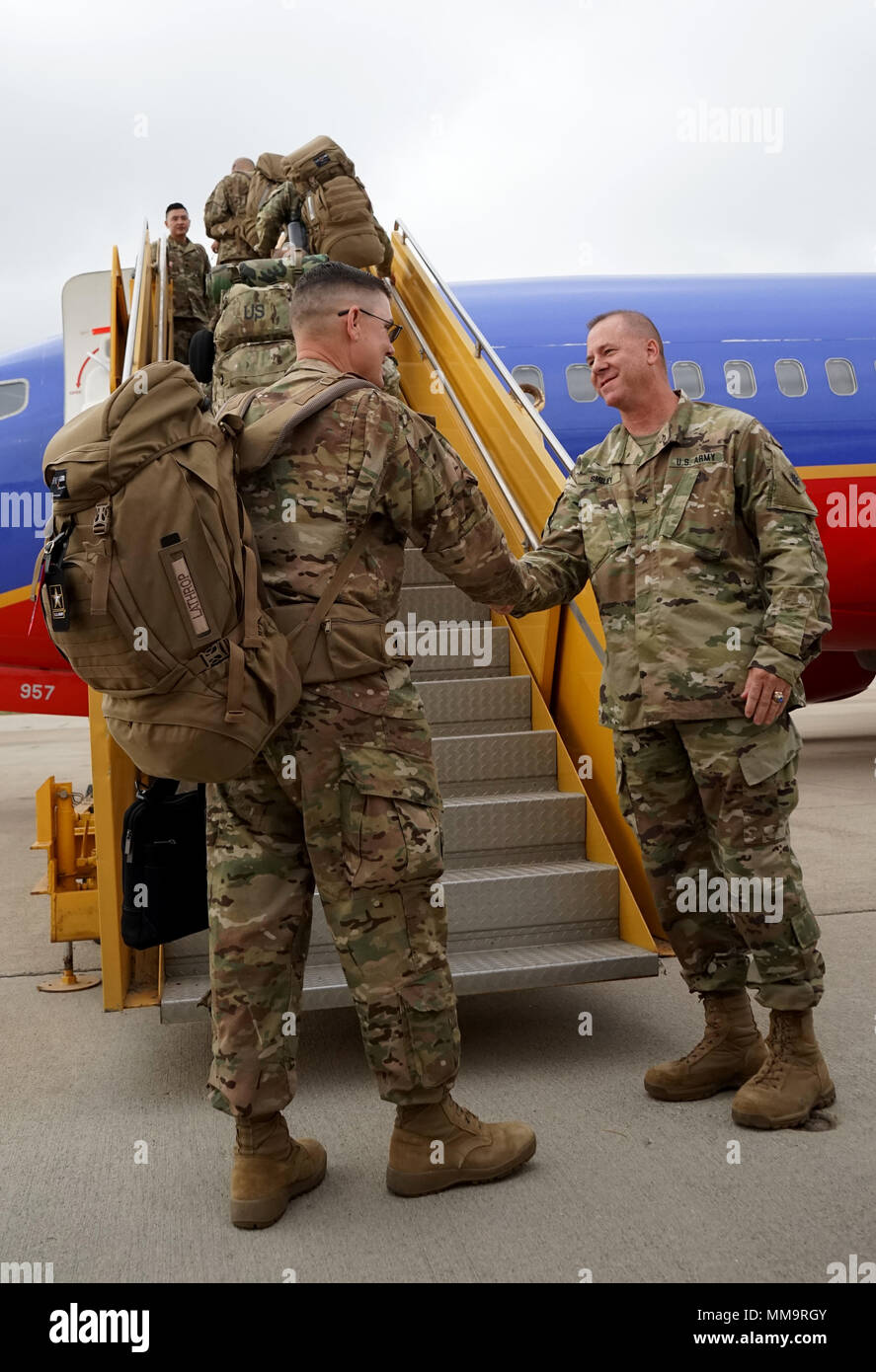 Brig. Gen. John W. Lathrop shakes hands with Brig. Gen. Jeffrey D ...