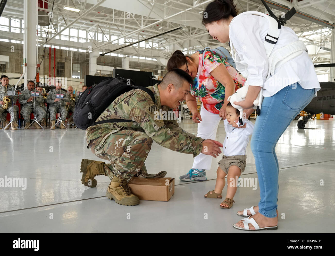 A Soldier with the CalGuard’s 40th Infantry Division watches his child ...