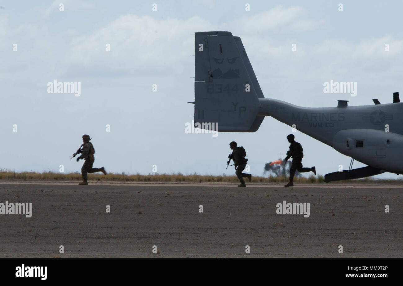 Marines with 1st Marine Division disembark an MV-22B Osprey during the Marine air-ground task ...