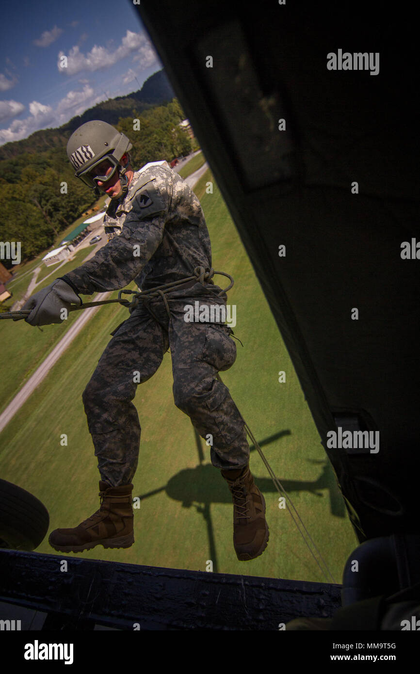 Students of Air Assault class 307-17 rappel from a helicopter to ...