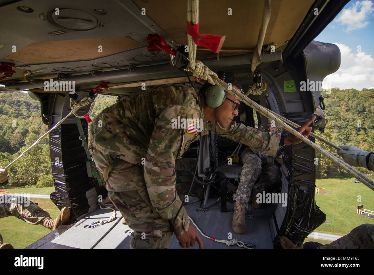 Students of Air Assault class 307-17 rappel from a helicopter to ...