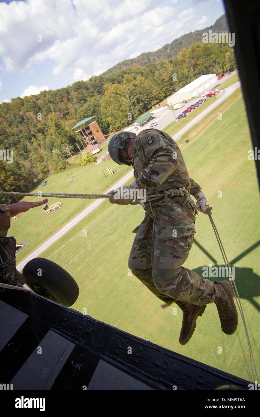 Students of Air Assault class 307-17 rappel from a helicopter to ...