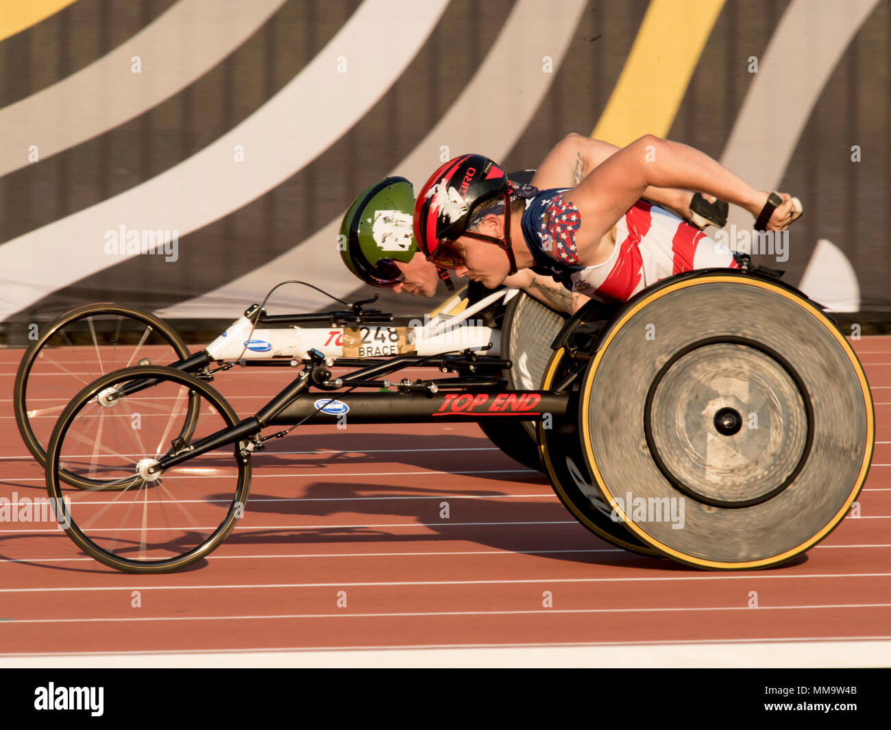 Marine Corps Sgt. Ivan Sears (R) drives past the U.K.'s Andrew Bracey ...