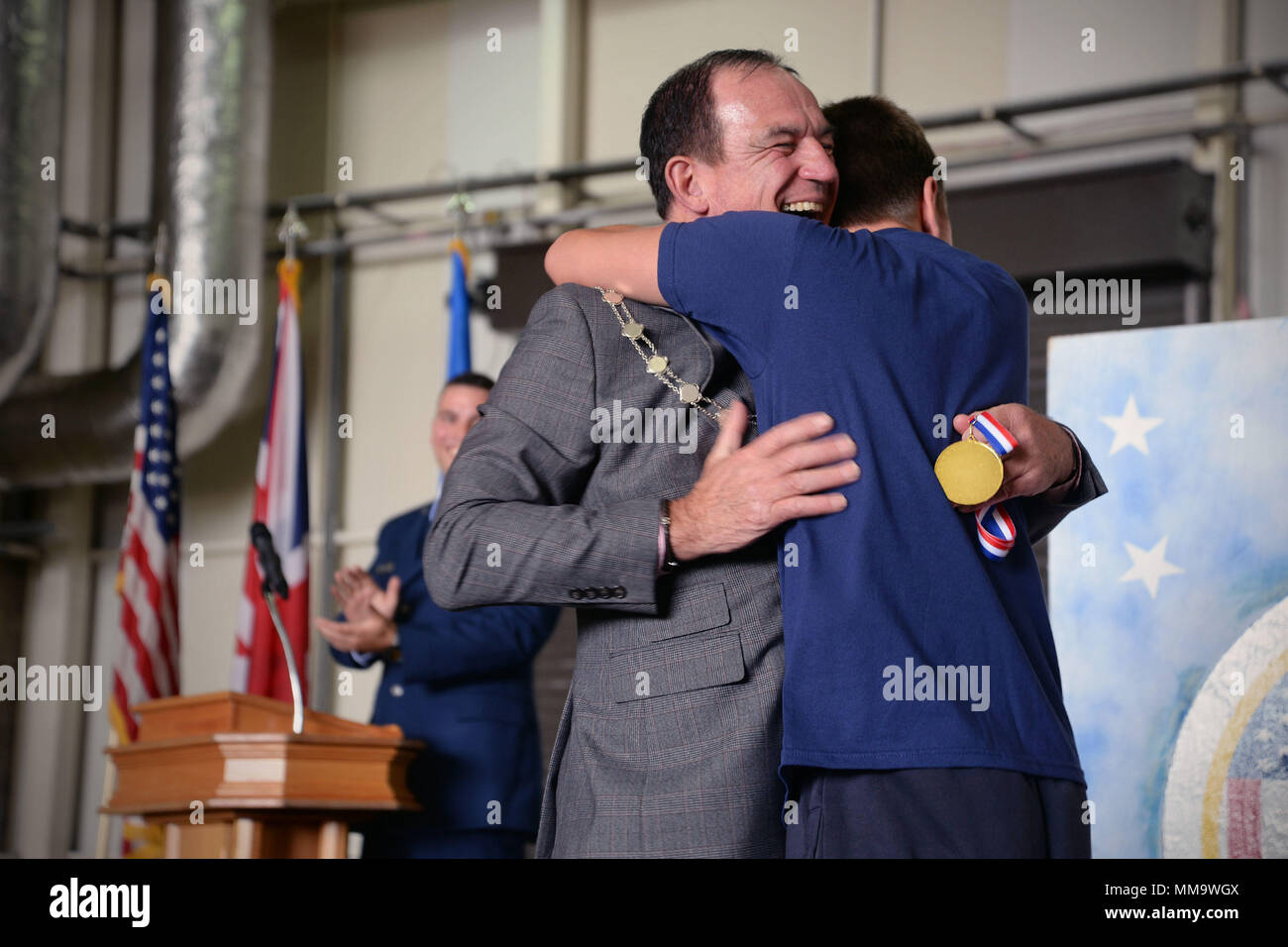 Councilor Terry Clements, Mayor of Edmundsbury, embraces one of the ...