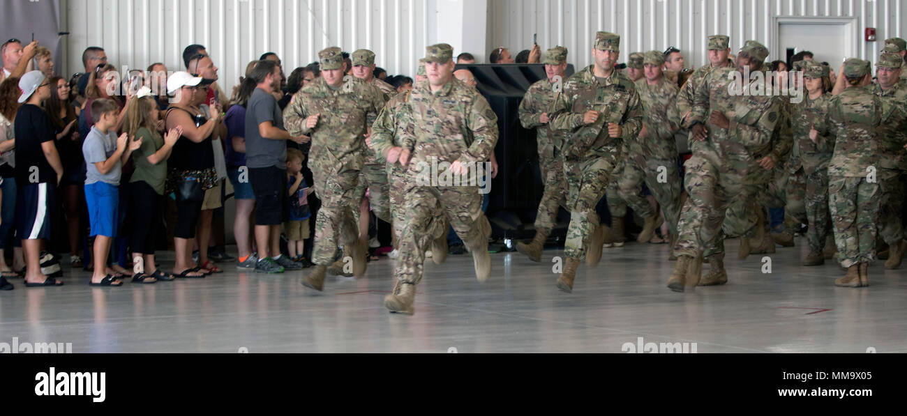 The Soldiers of the 3637th Maintenance Co. storm into the hanger during ...