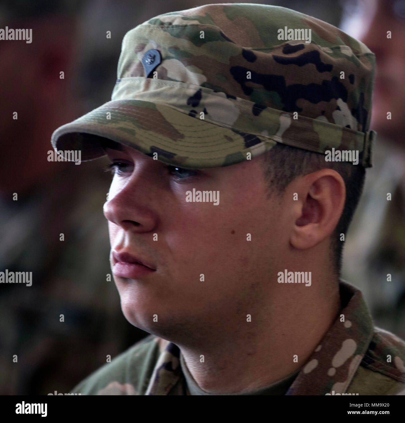 A Soldier with the 3637th Support Maintenance Company listens to his ...