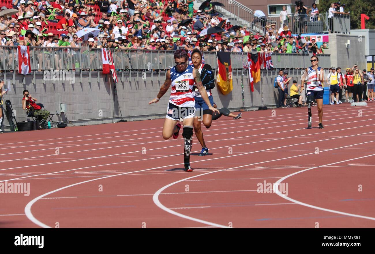 U.S. Marine Corps veteran Sarah Rudder crosses the finish line ahead of ...