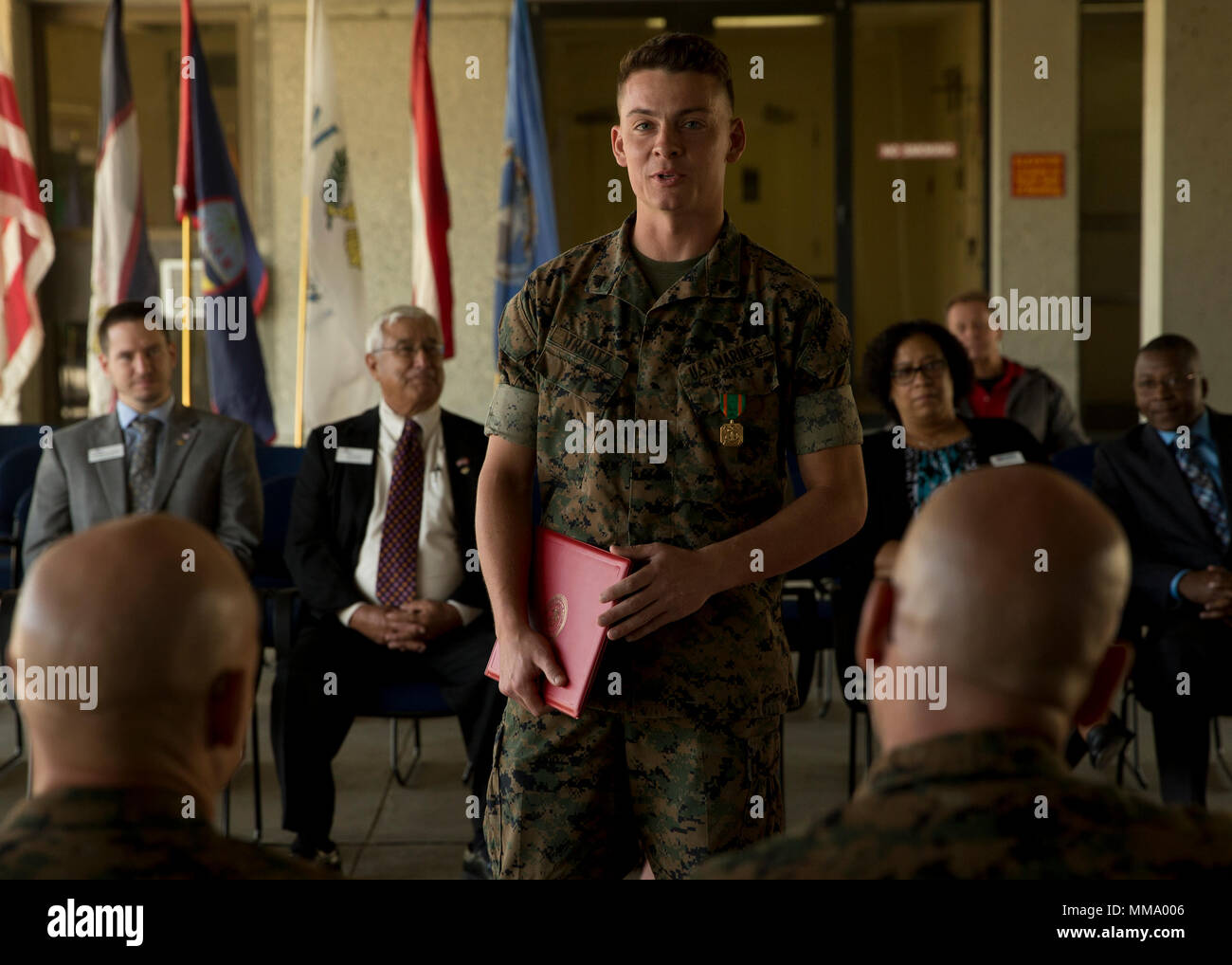 U.S. Marine Cpl. Kristopher R. Trautz receives a Non-Commissioned ...