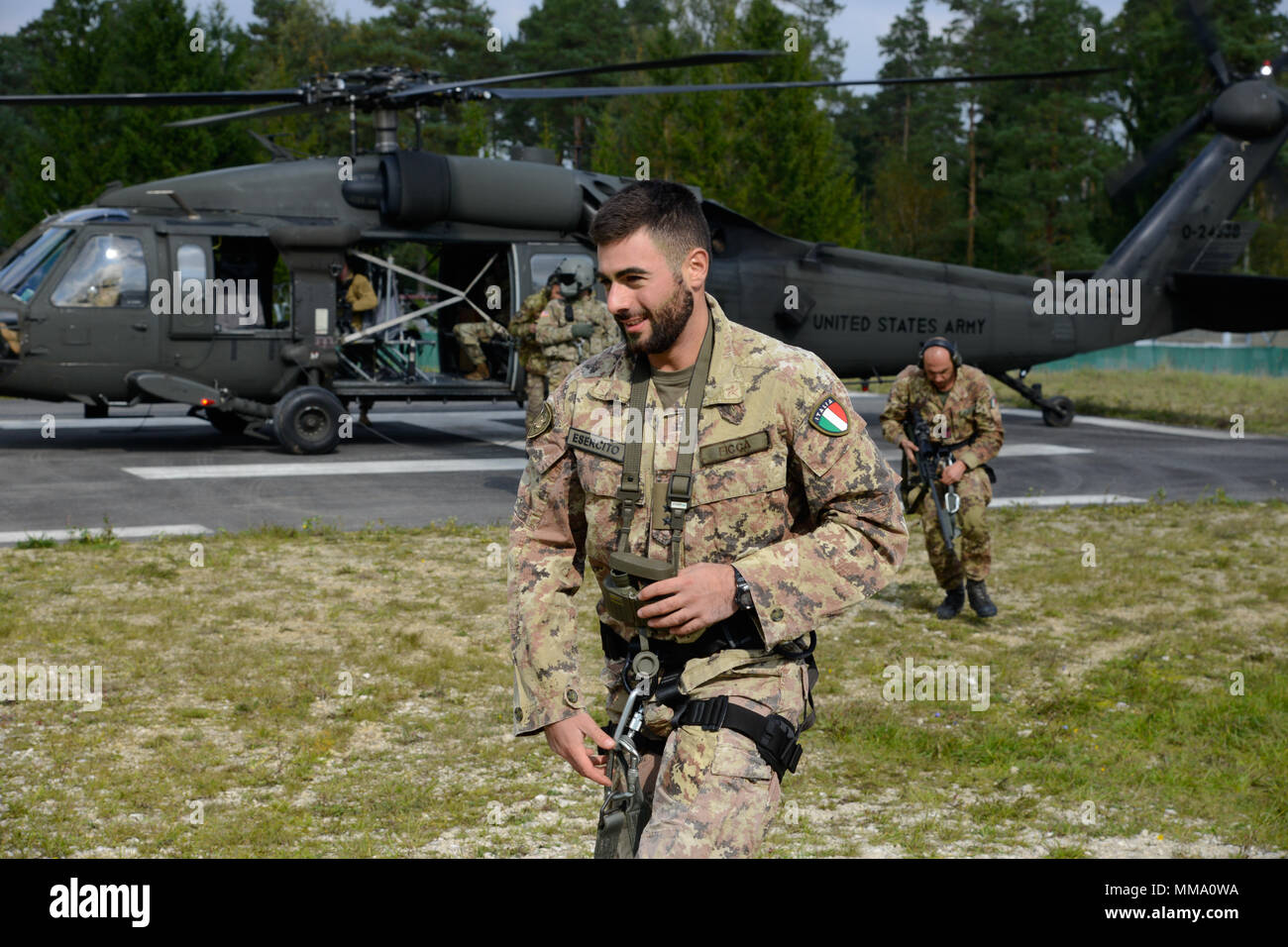 Italian soldiers exit a UH-60 Black Hawk, operated by U.S. Soldiers ...