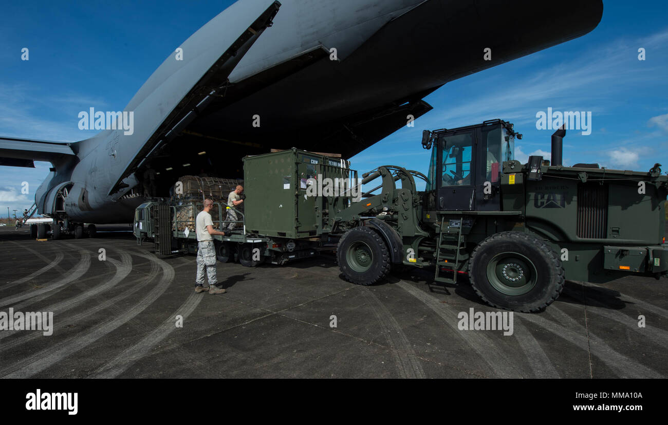 The 821st Contingency Response Group equipment is offloaded from a C-17 ...