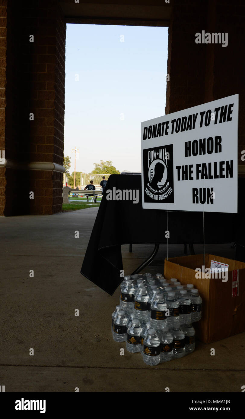 Airmen wait before the kick-off of the Honor the Fallen run at the ...