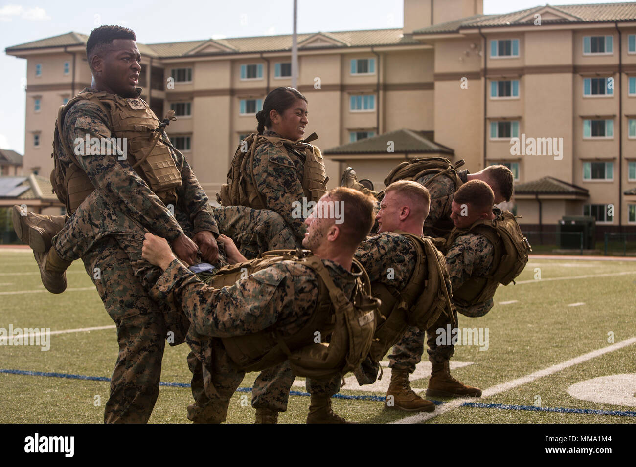 U.S. Marines conduct buddy sit-ups during a Martial Arts Instructors ...