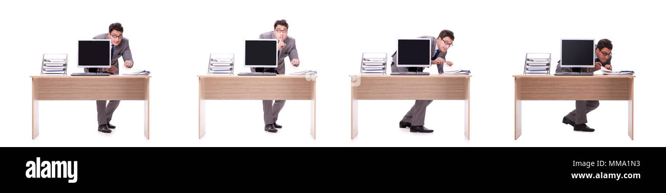 Businessman hiding in the office isolated on white Stock Photo - Alamy