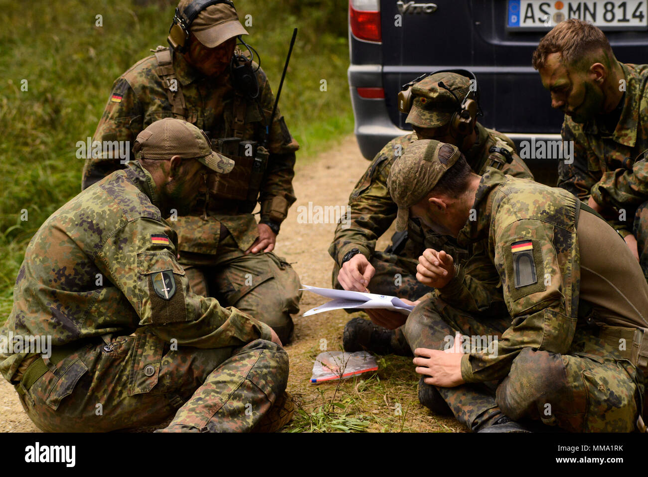 German soldiers plan out their movement though the terrain during the ...