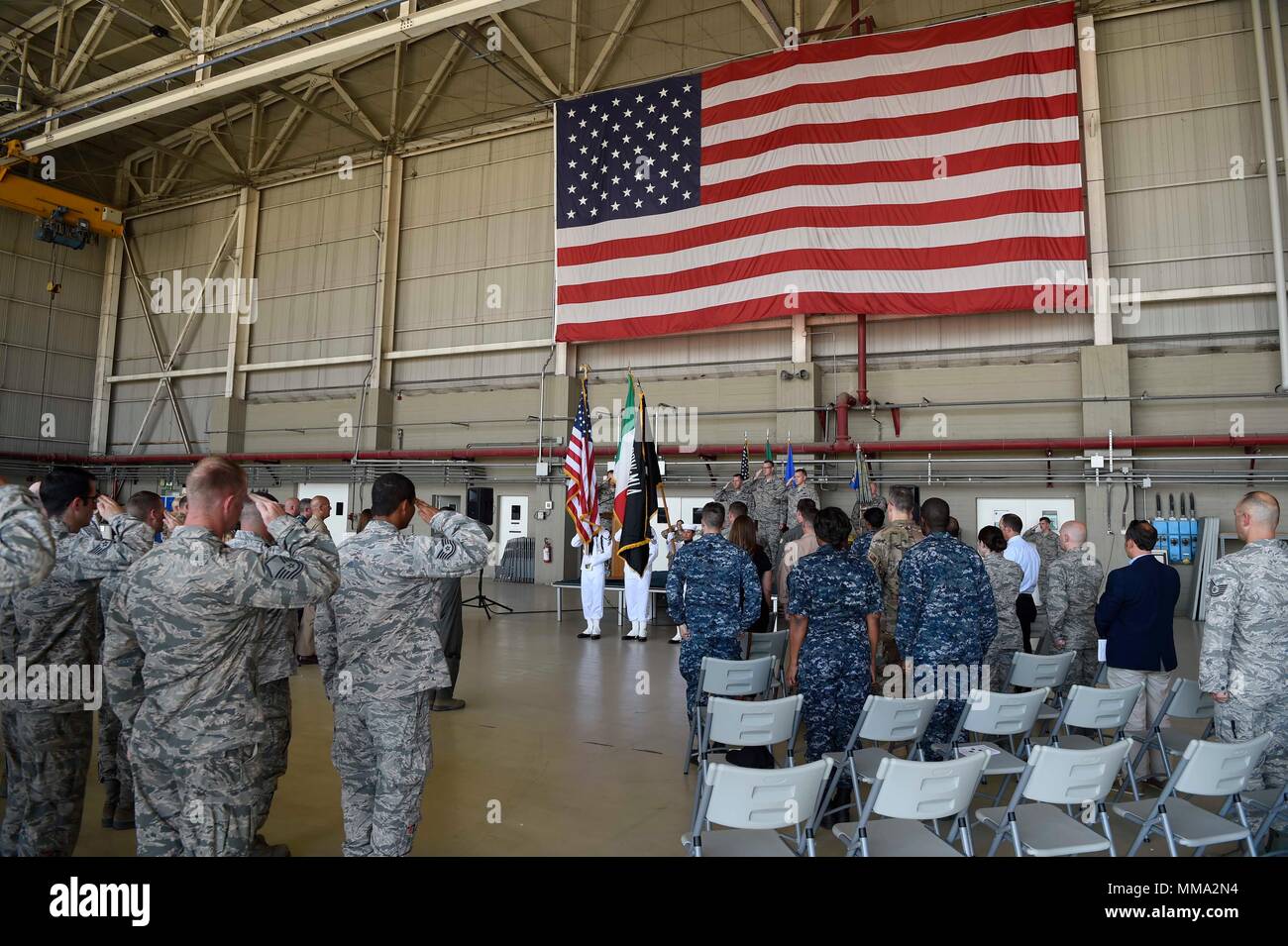 U.S. Air Force, Navy and Italian Air Force service members salute and ...