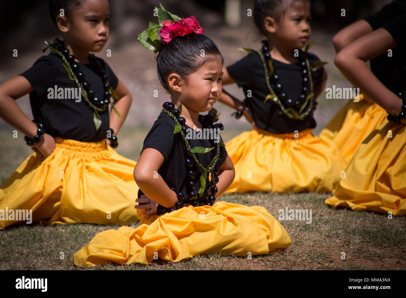 A group of children perform a traditional hula dance during the Bellows ...