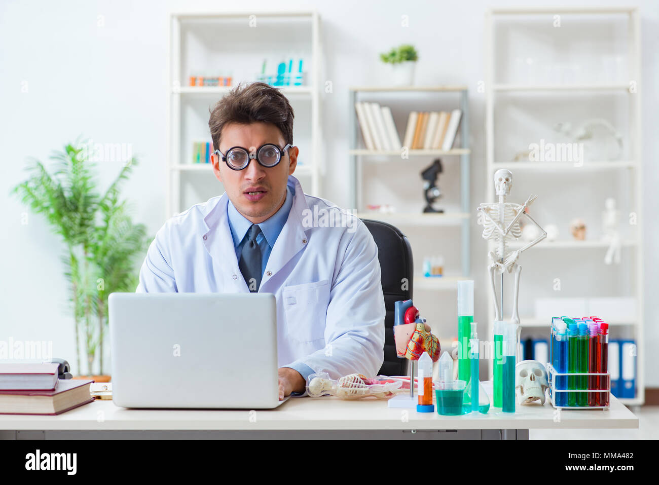 Funny doctor having fun in hospital lab Stock Photo - Alamy