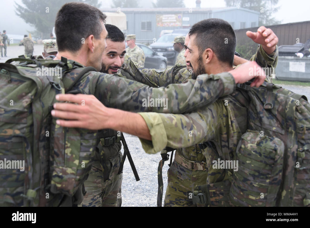 Spanish soldiers finish the 12-mile ruck march as part of the European ...