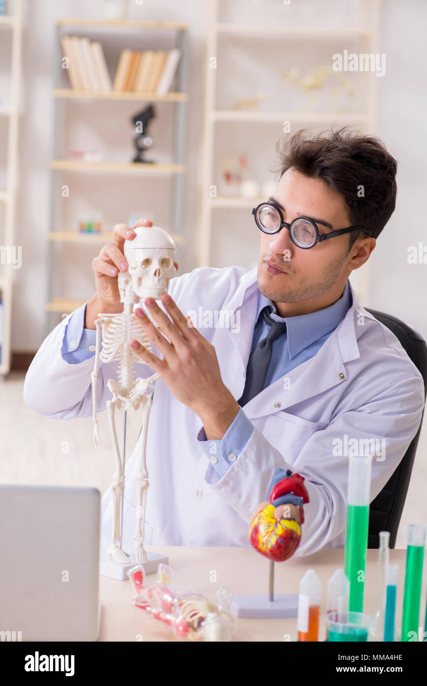 Funny doctor having fun in hospital lab Stock Photo - Alamy
