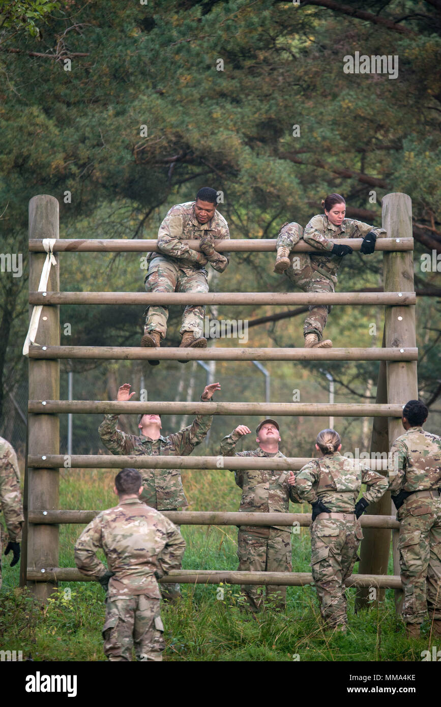 U.S. Soldiers assigned to 52nd Signal Battalion negotiates obstacles ...