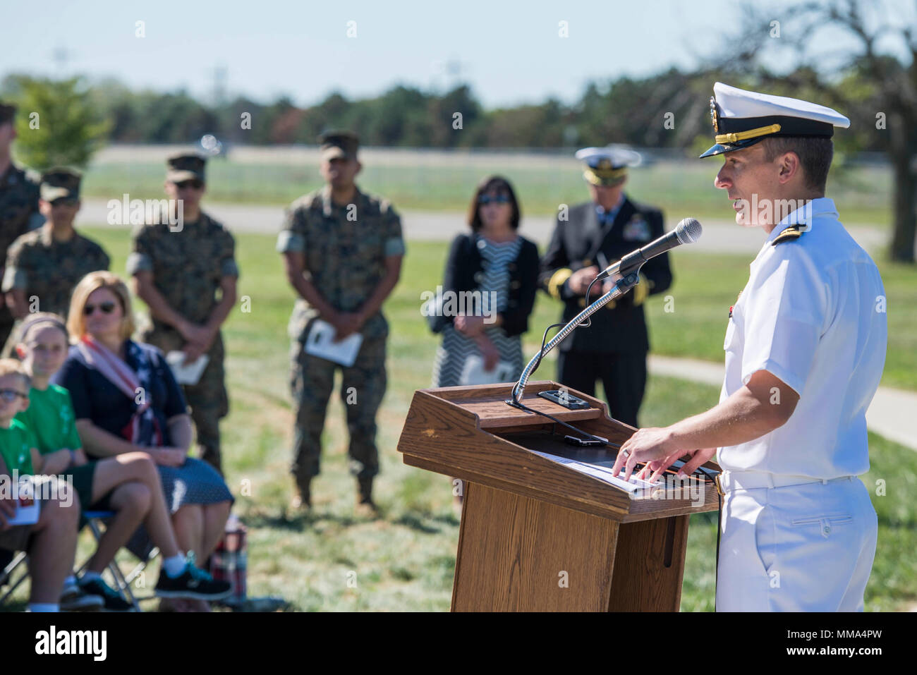 U.S. Navy Reserves Lt. j.g. Matthew Previts, welcomes the audience to ...