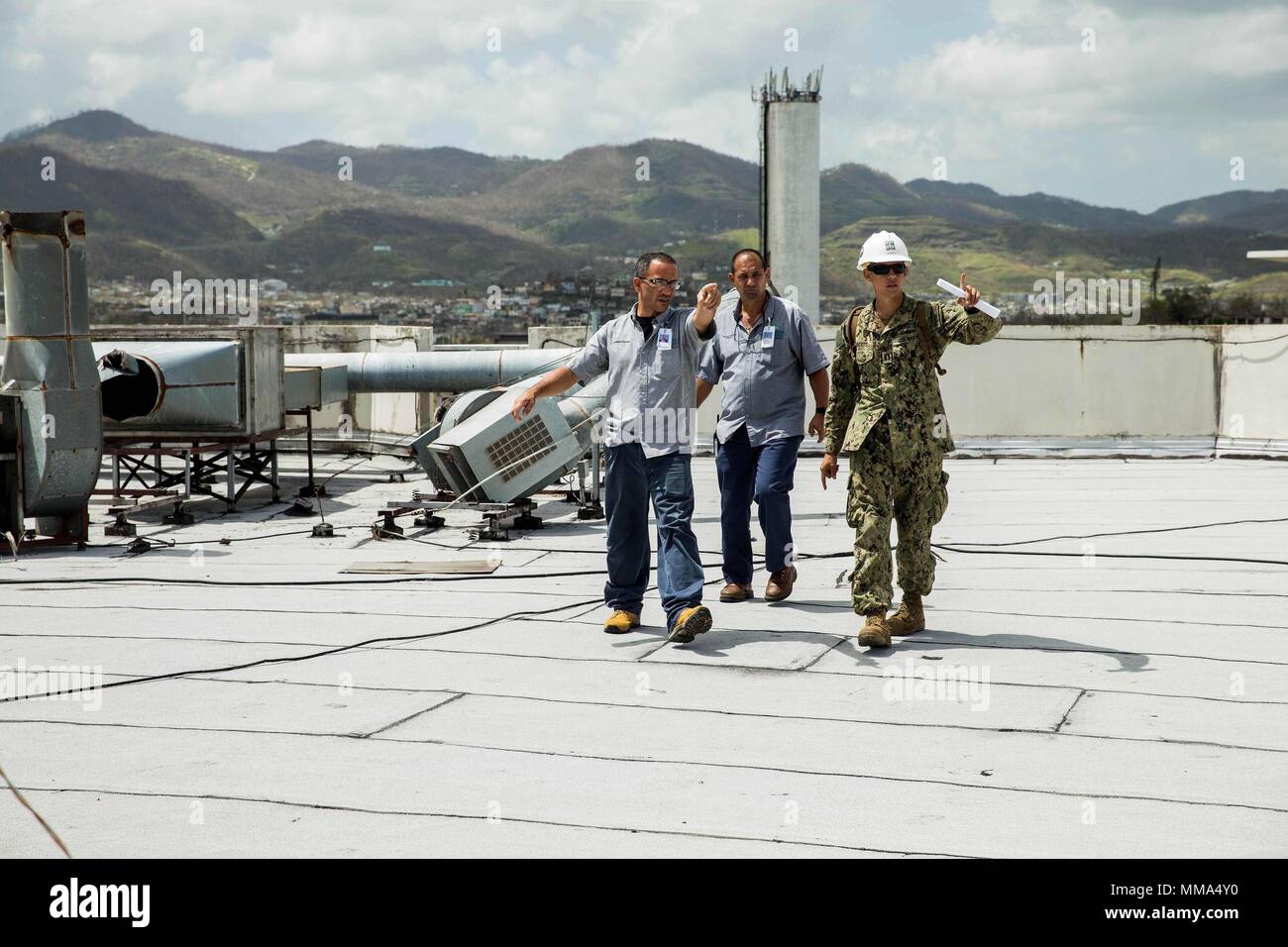 U.S. Navy Lt. Colin A. Roberts, right, a civil engineer core inspector ...