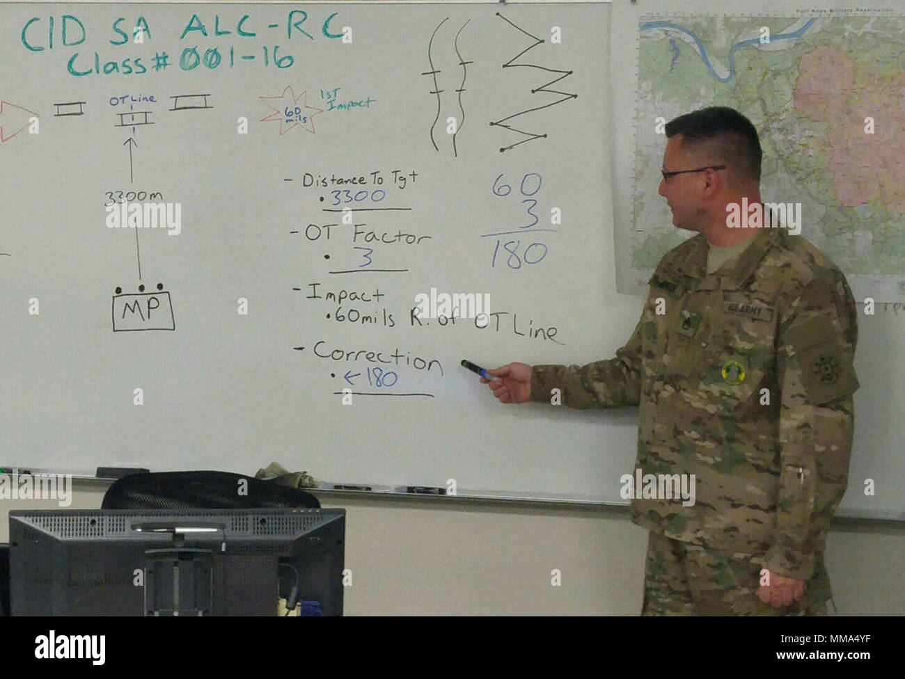 Staff Sgt. Anthony Johnson (middle), a U.S. Army Reserve Special Agent ...