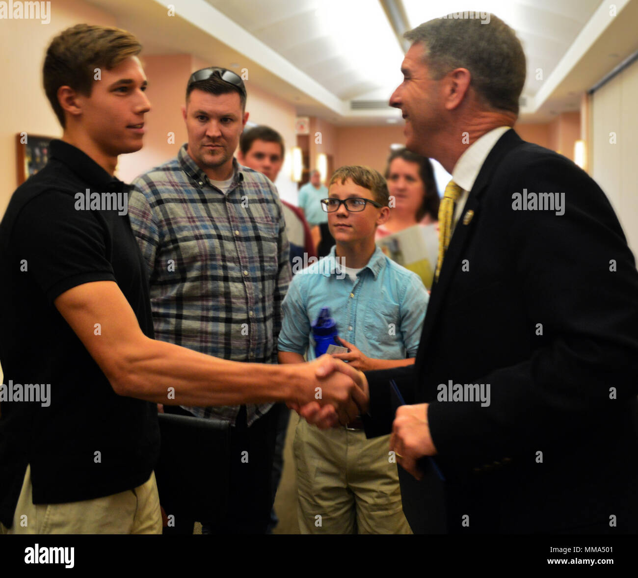 A young man shakes Representative Rob Wittman's hand and thanks him for ...