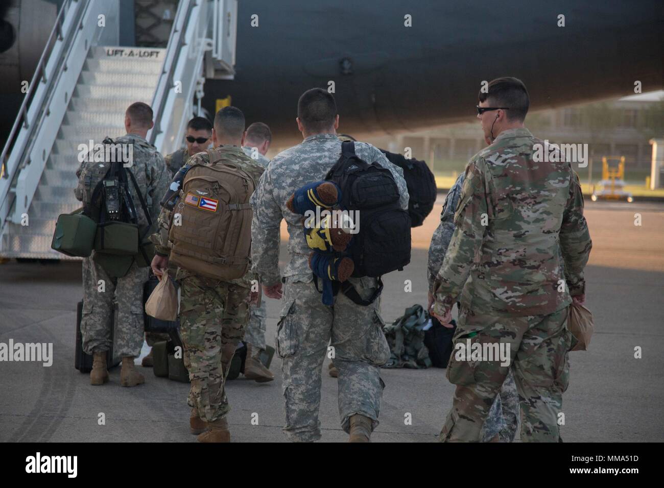U.S. Soldiers assigned to the 101st Combat Aviation Brigade (CAB) board ...