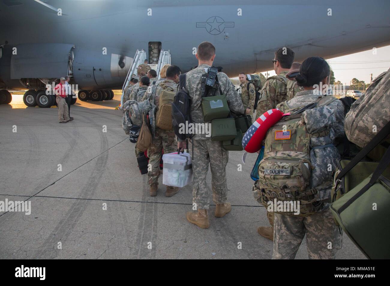 U.S. Soldiers assigned to the 101st Combat Aviation Brigade (CAB) board ...