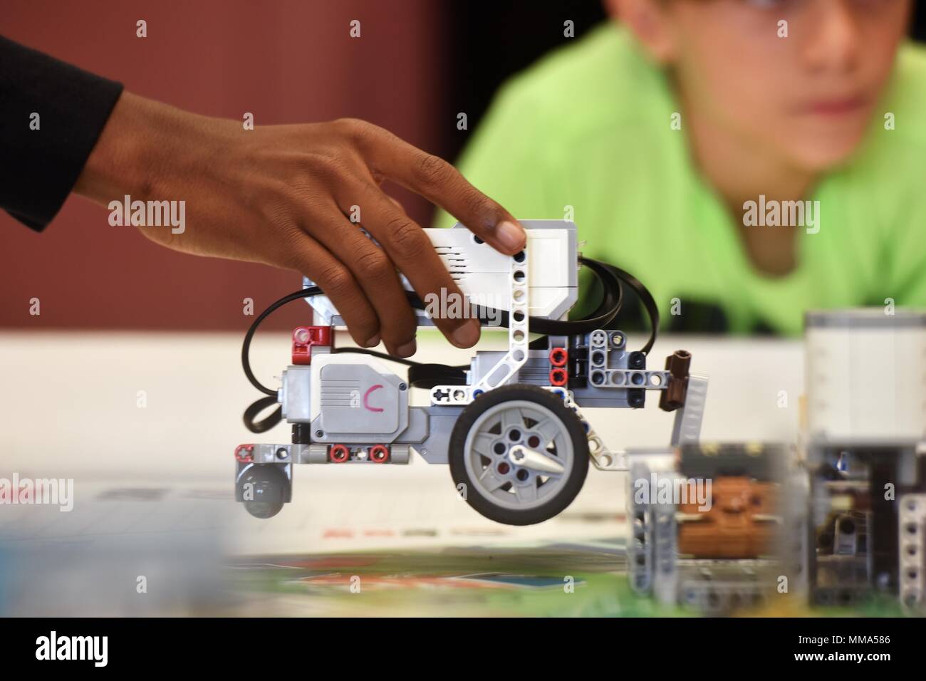 Members of Whiteman’s FIRST® LEGO® robotics team practice clearing ...