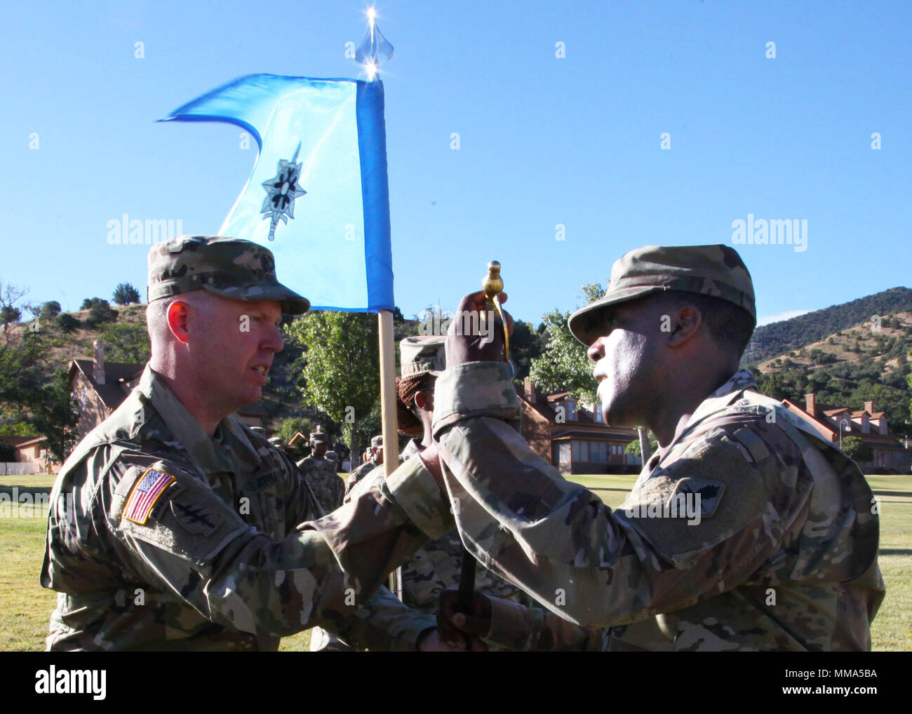 The outgoing First Sergeant, First Sgt. Julius Eldridge, passes the NCO ...