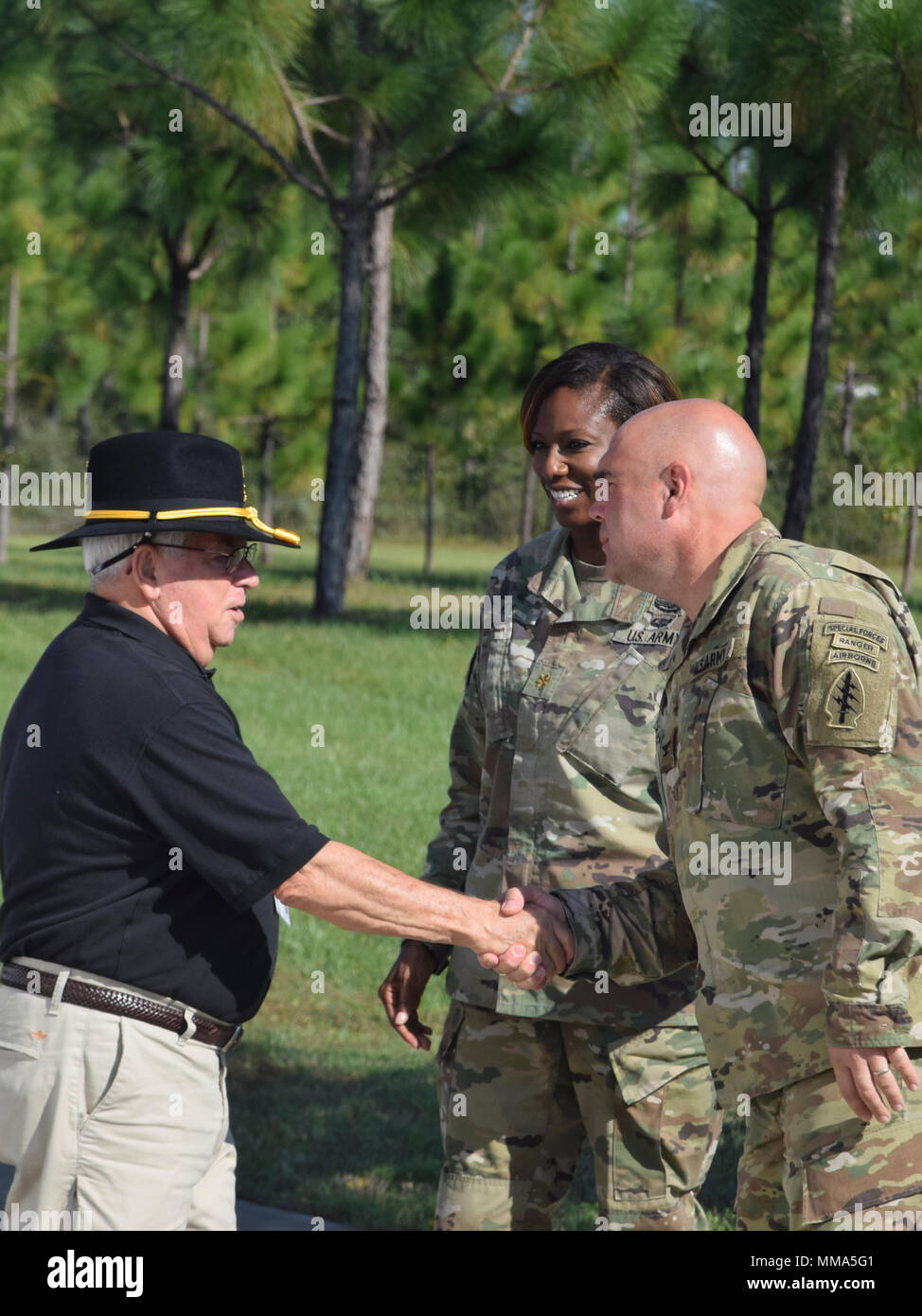Col. Patrick Colloton, 7th SFG (A) commander (right) and Maj. Kimbia ...