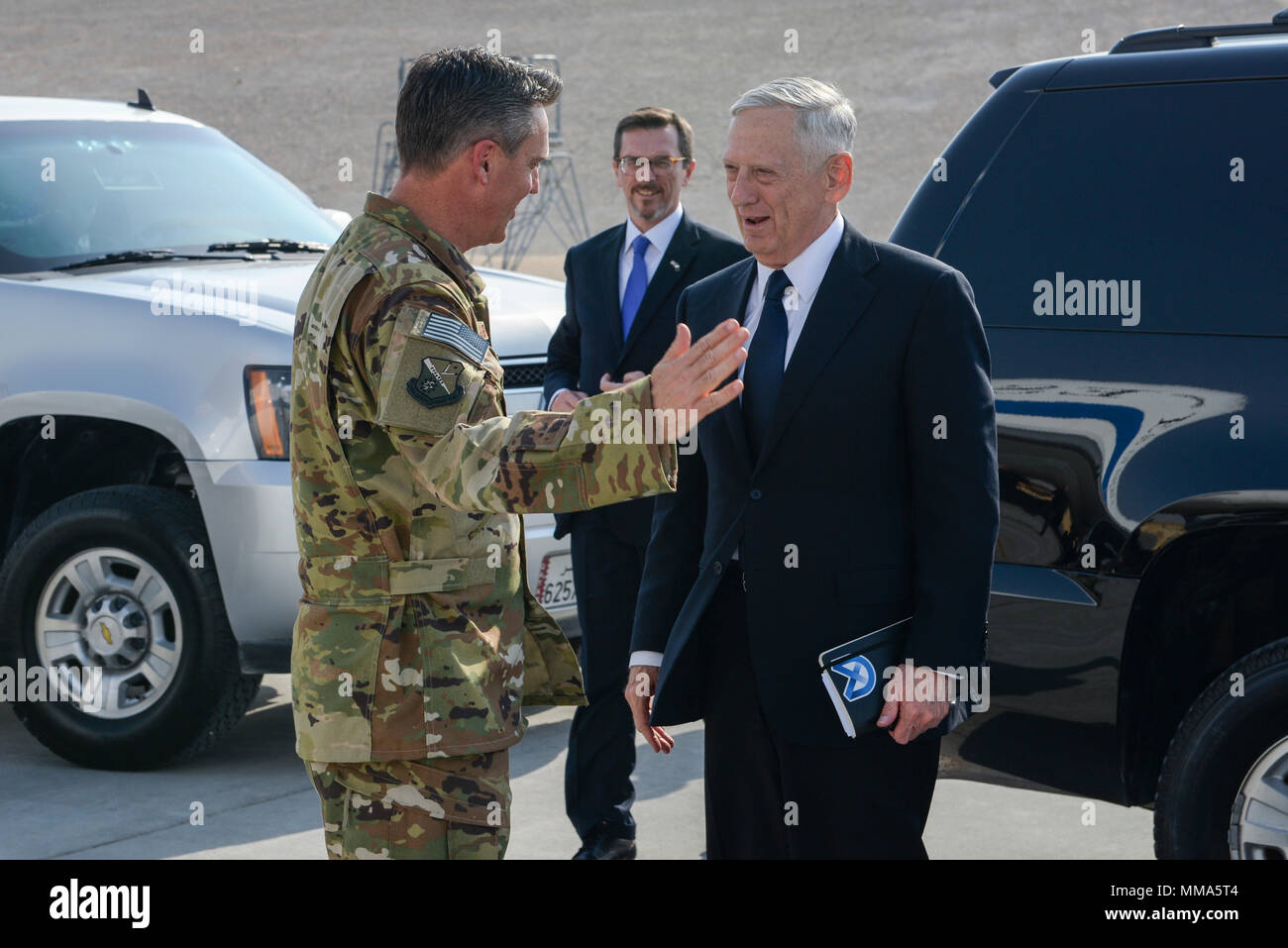 Secretary of Defense Jim Mattis speaks with U.S. Air Force Brig. Gen. Jason R. Armagost ...