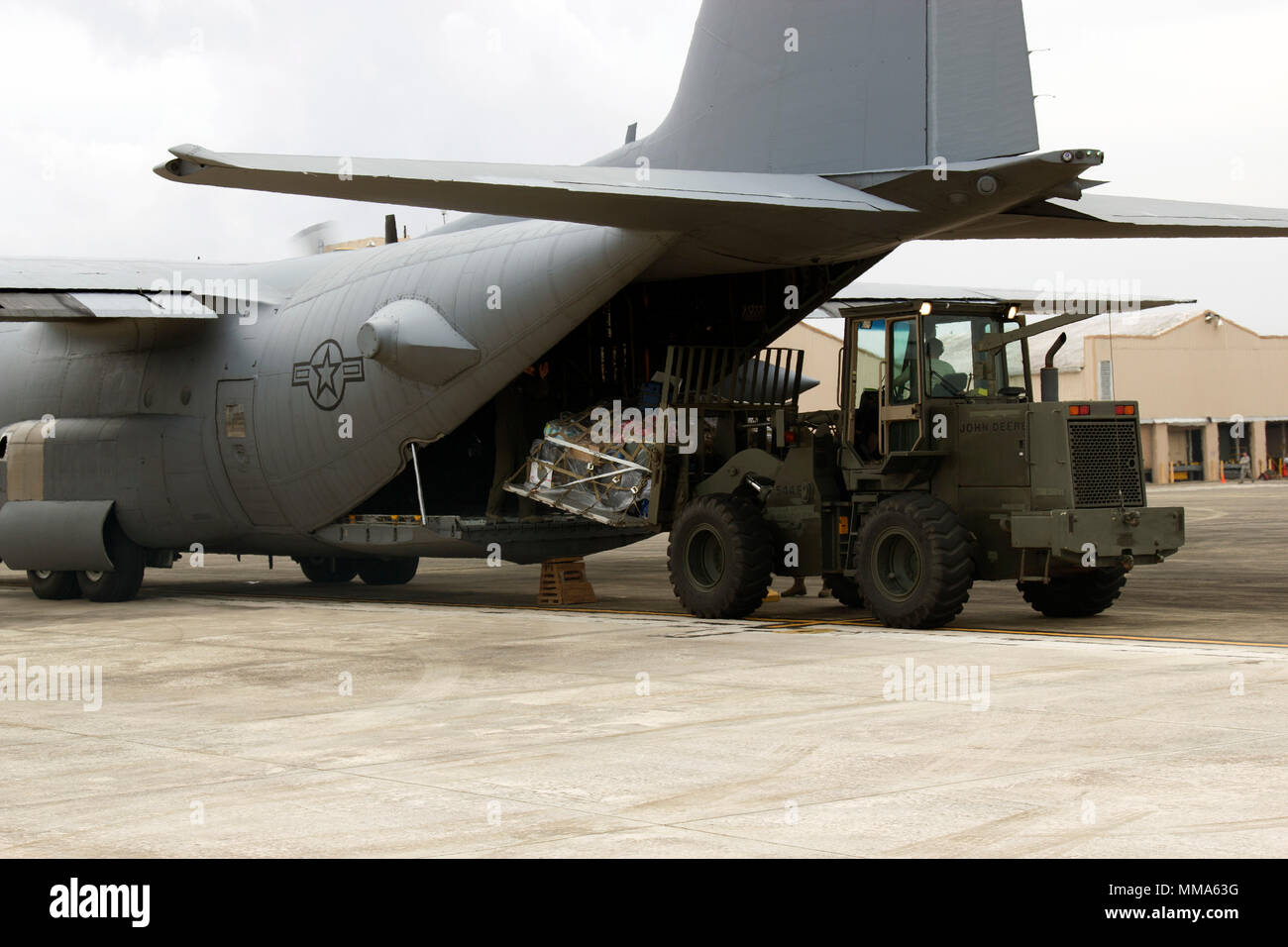 Puerto Rico Air National Guard Citizen-Airmen unload and move supplies ...