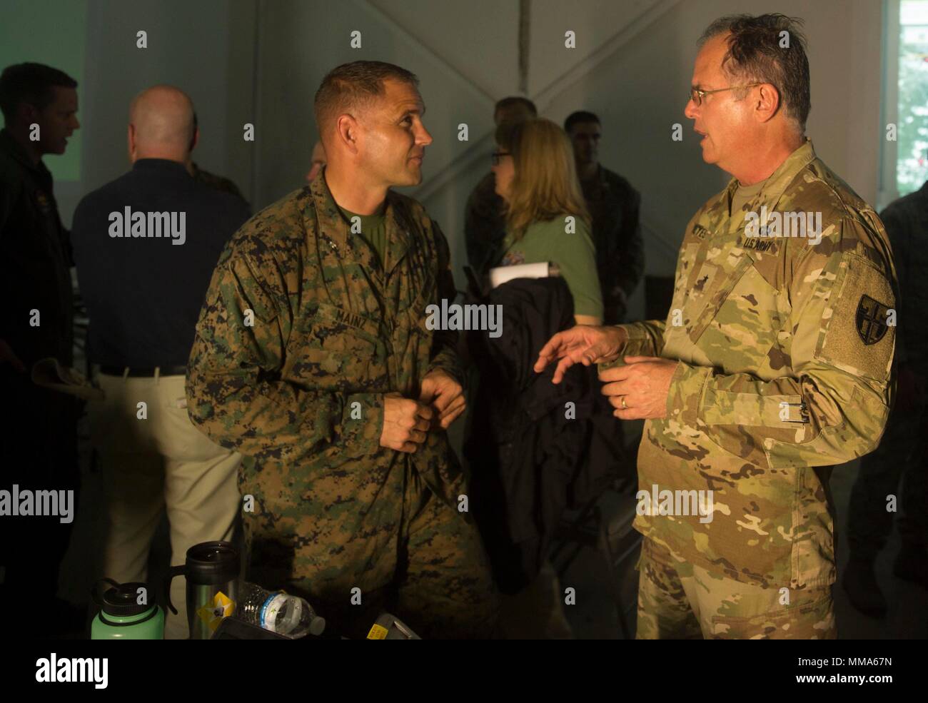 U.S. Marine Corps Lt. Col. Marcus J. Mainz, left, the battalion ...